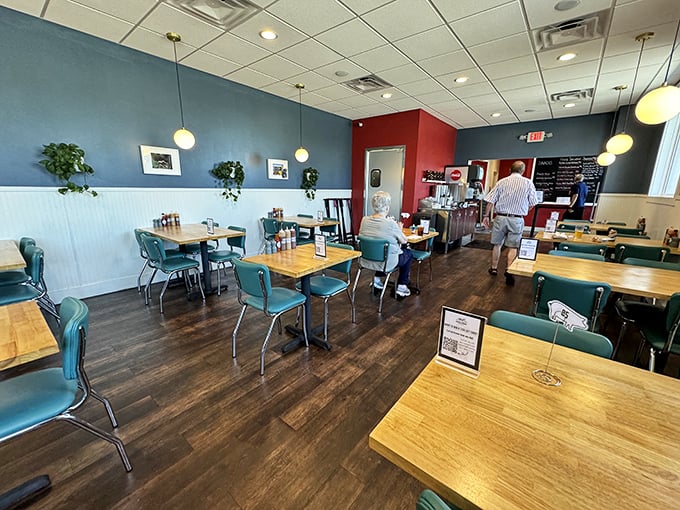 Blue walls, wooden tables, and retro chairs create the perfect backdrop for the serious business of barbecue appreciation.