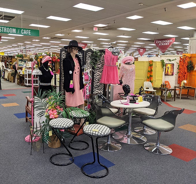Mannequins dressed in vintage finery stand guard over mid-century furniture. The silent sentinels of style from decades past.