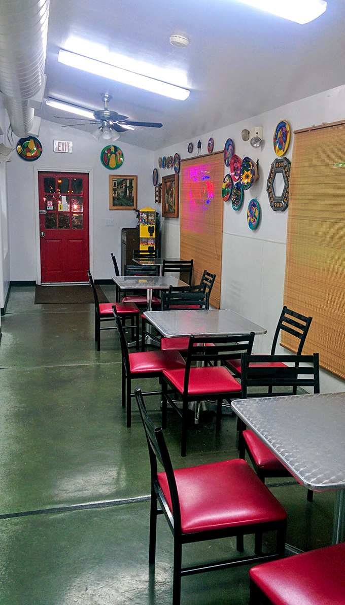 Simple tables, colorful folk art, and red chairs that say, "Sit down, relax, the food is worth the wait."