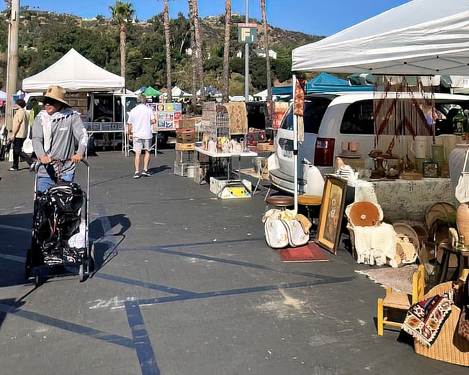 Sunlight bathes the market as early birds navigate rows of potential treasures, with the San Gabriel Mountains providing a dramatic backdrop to this bargain paradise.