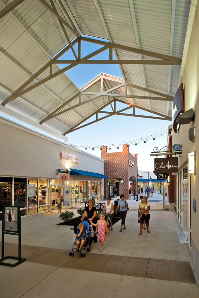 Retail therapy under open skies! The covered walkways offer protection from the elements while shoppers hunt for treasures, strollers and shopping bags in tow.