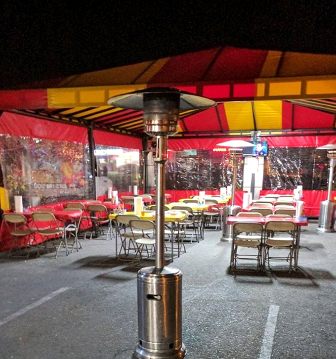 Dining al fresco under the stars. This no-frills tent setup transforms into Phoenix's most democratic dining room after sunset.
