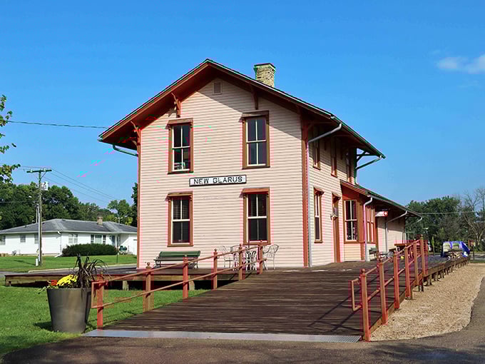 This charming historic train depot now serves as a visitor center, its red trim and wooden platform inviting travelers to step back in time.