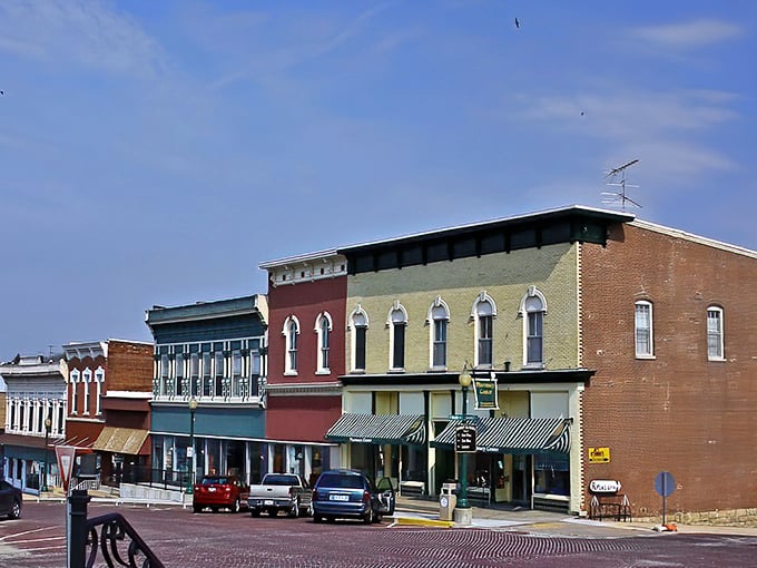A rainbow of historic storefronts stands shoulder to shoulder, each building telling its own century-old tale through ornate cornices and weathered brick.