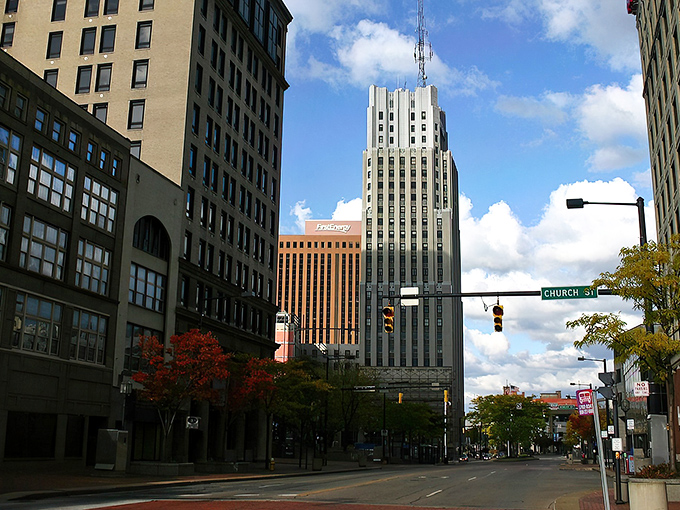 Akron's downtown skyline showcases the city's industrial heritage with a modern twist. The Church Street sign points the way to urban adventures waiting to be discovered.