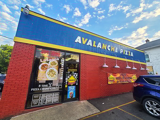 Avalanche Pizza's bold blue and red building is like a superhero headquarters for pizza lovers in Athens.