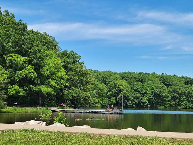 Summer serenity! Beaver Dam's crystal-clear waters welcome kayakers and anglers alike, with shady shores perfect for afternoon picnics.