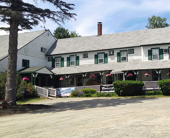 Classic New England charm with a welcome sign that practically shouts, "Come in and stay awhile!" Those hanging flowers aren't the only things blooming here.