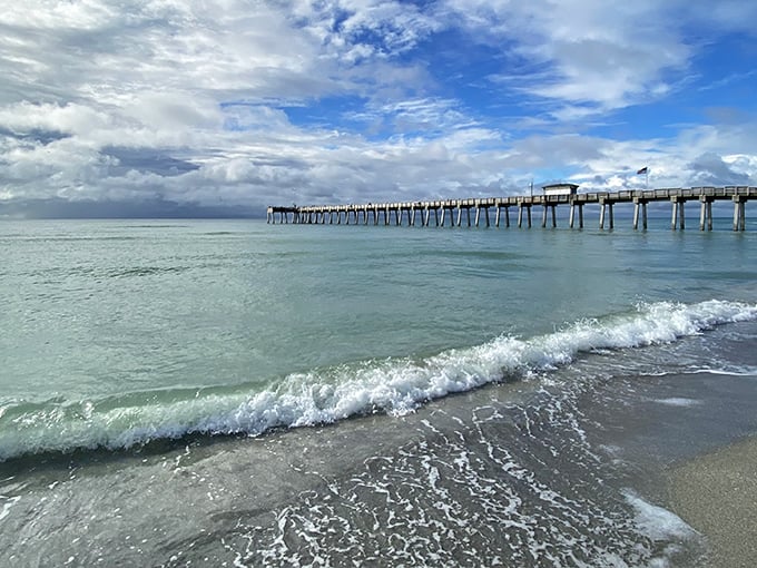 Crystal clear waters meet endless blue skies at this Gulf Coast gem where fishing pier views steal the show.