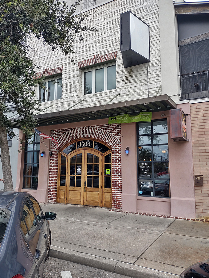 That brick archway entrance promises pizza adventures - like finding a hidden speakeasy for carbs.