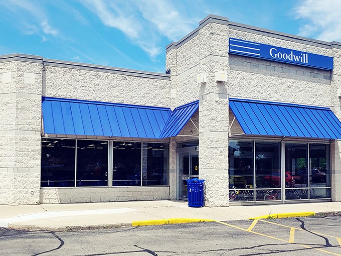 Goodwill's bright blue awnings welcome bargain hunters like a beacon of thrifty hope. The mothership has landed!