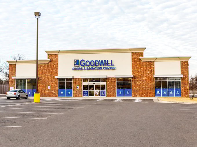 Goodwill's brick facade houses a universe of second chances. Like a department store where everything comes with a story.