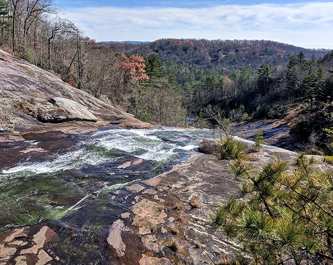 Rushing waters carve their way through ancient rock. Mother Nature's sculpting skills on full display.