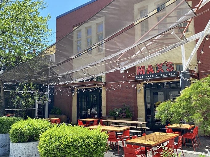 Max's outdoor patio with its string lights and bright red chairs practically screams "pizza party tonight!" Coal-fired perfection awaits inside.