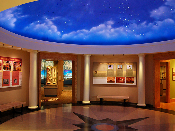 Step into a magical realm where the ceiling mimics a starlit sky, inviting you to explore miniature worlds frozen in time.