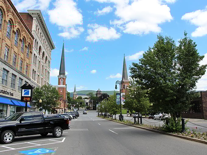 The twin church spires of North Adams stand sentinel over a town where mill buildings now house galleries and affordable apartments.