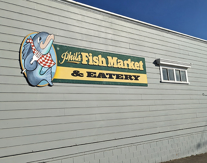 Phil's Fish Market's weathered sign promises exactly what you'll get: seafood that tastes like it jumped straight from ocean to plate.