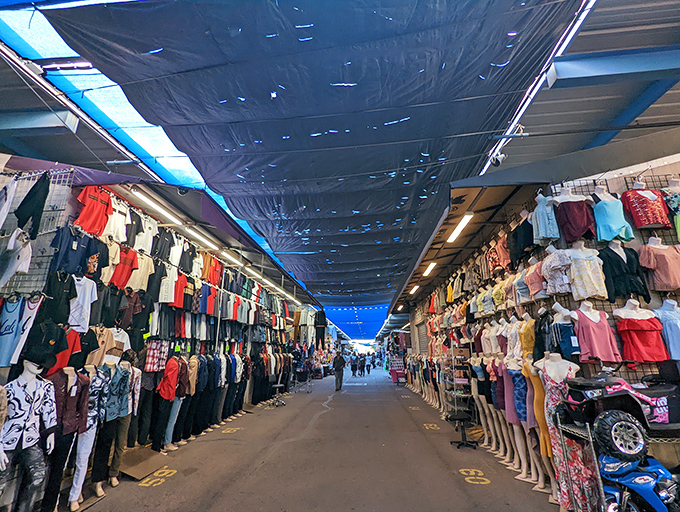 Blue tarps create a desert oasis of commerce at Phoenix Park 'n Swap. The fashion district rivals Milan—if Milan sold three t-shirts for $10!
