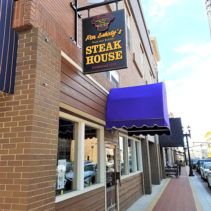 That bright blue awning signals joy ahead&mdash;like finding an oasis where steak dreams come true in downtown Anderson.