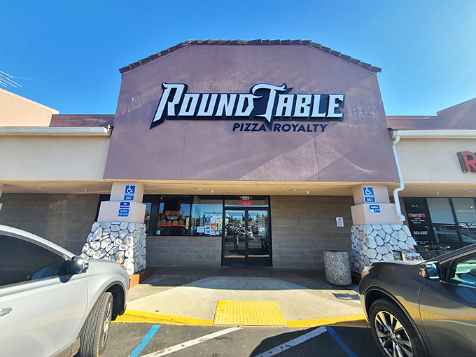 Round Table Pizza's castle-inspired facade isn't just about medieval theming – it's promising a royal feast fit for King Arthur himself.