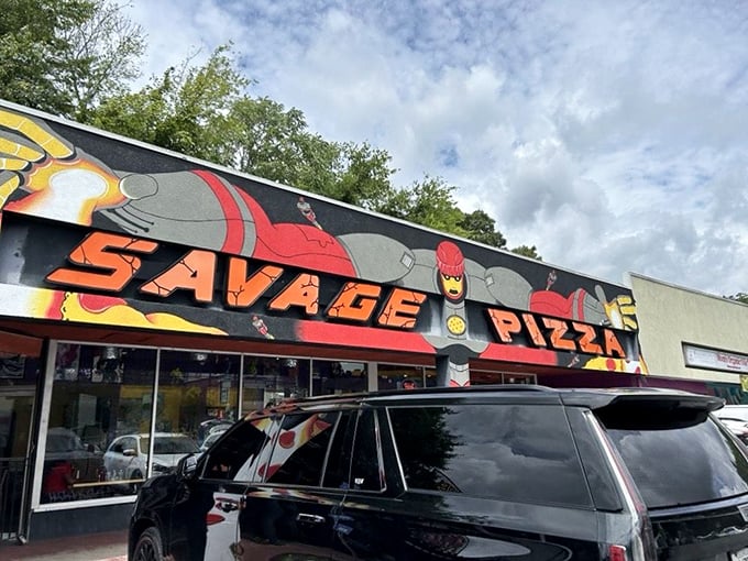 Comic book heroes have to eat too! Savage Pizza's vibrant storefront looks like it leapt straight off the illustrated page.