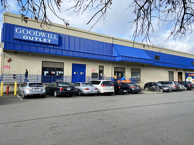 Blue awnings and a full parking lot&mdash;the telltale signs of serious thrifters at work at Seattle Goodwill Outlet.