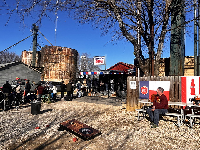Snow's BBQ's rustic outdoor setup &ndash; where lawn games and smoky aromas create the perfect Saturday morning ritual.