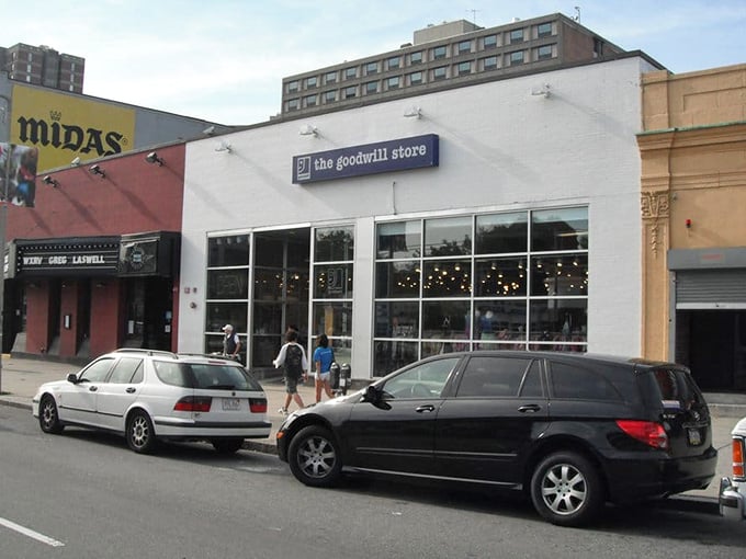 The Goodwill storefront stands ready for urban adventurers seeking secondhand gold in Boston's bustling streets.