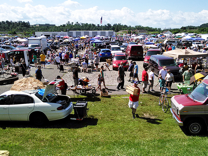 Bargain city in full swing! Trader Jack's sprawling outdoor market draws crowds of treasure seekers under the summer sun.