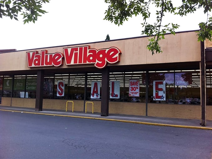Value Village's storefront beckons with the siren song of "SALE" - resistance is futile for dedicated thrifters.