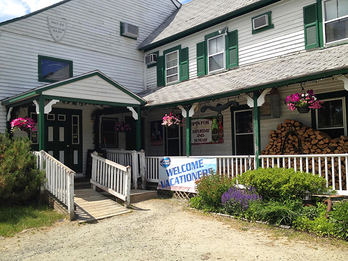 White clapboard, green shutters, and a porch that whispers, "Sit down and forget your troubles." Norman Rockwell would've ordered the ribeye.