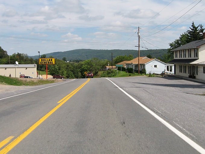 Capon Bridge's rolling hills create a postcard-perfect setting where the Dollar General doubles as the social hub of local gossip.