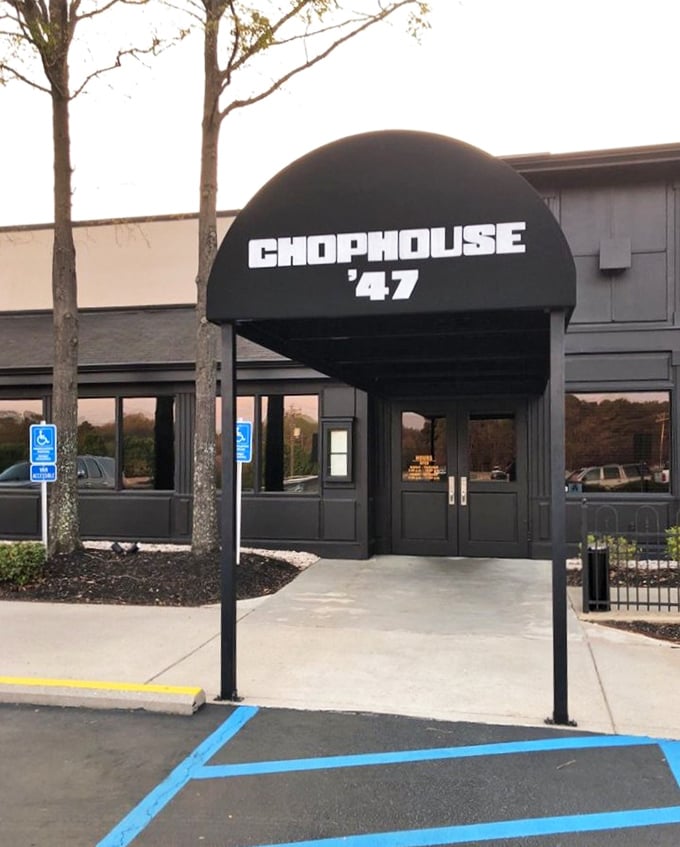 The bold awning of Chophouse '47 stands out like a beacon for hungry travelers. This is where steak dreams come true.