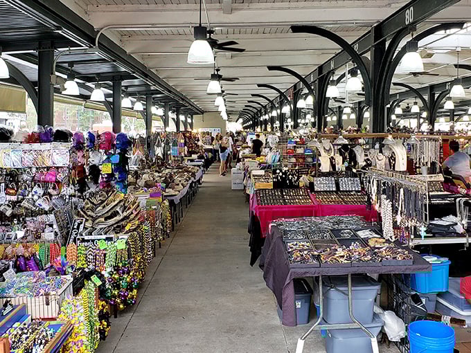 Beneath historic beams, vendors display dazzling arrays of beads, crafts, and souvenirs – a feast for the eyes in the French Quarter.