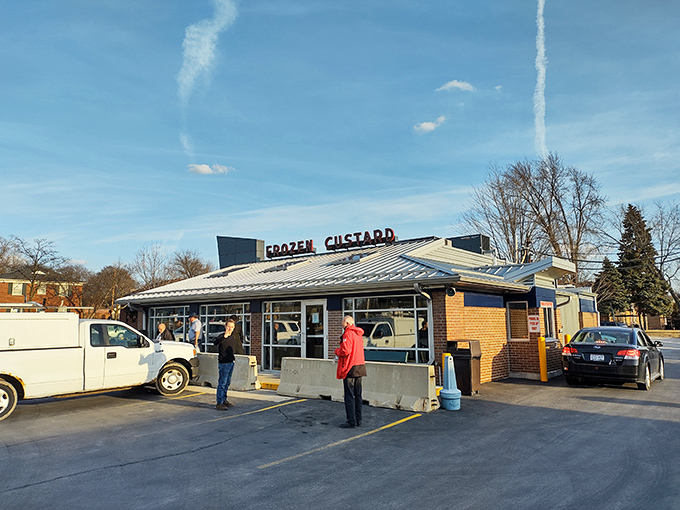 The afternoon sun casts a spotlight on Gilles, as if nature itself is giving this classic custard stand a standing ovation.