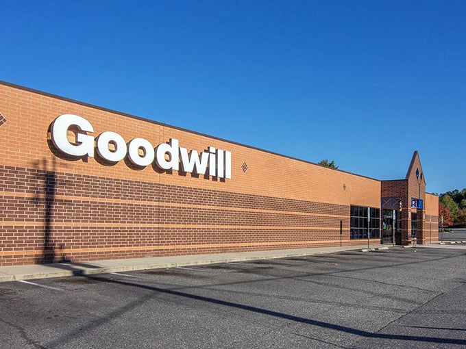Sunlight gleams off Goodwill's sign, beckoning treasure hunters inside. The thrill of the hunt begins here!
