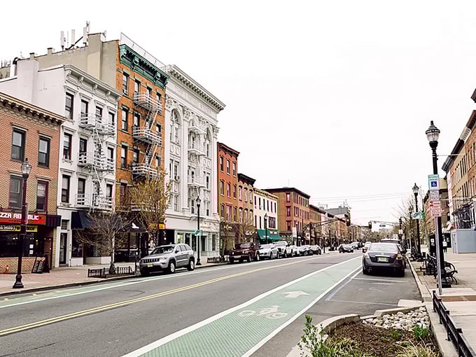 Classic brownstones and fire escapes line this charming street - like a movie set where real people actually live!