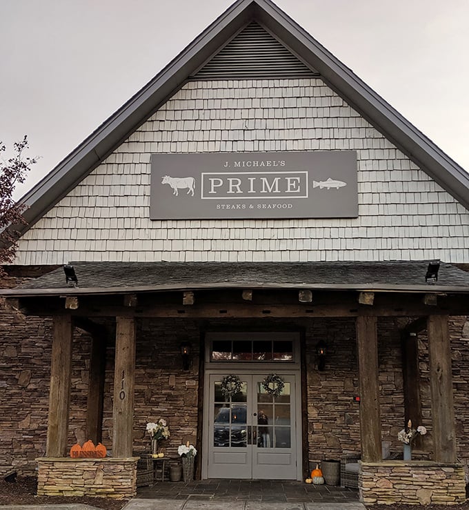 Where cabin dreams meet culinary reality. That American flag isn't just patriotic&mdash;it's signaling the all-American pleasure of perfect steak.