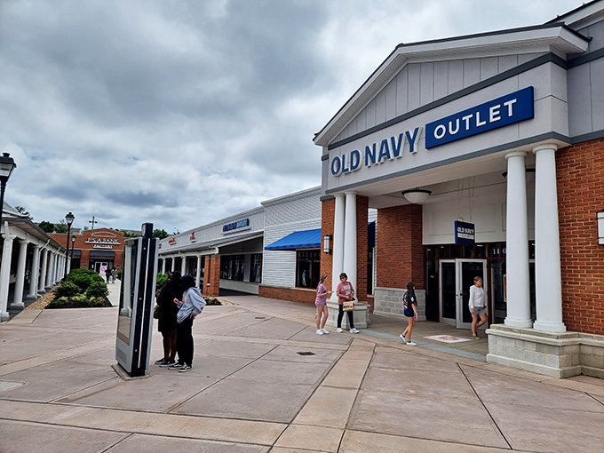 Old Navy's storefront welcomes shoppers with the promise of affordable basics. The brick walkways make bargain hunting feel like a stroll through history.