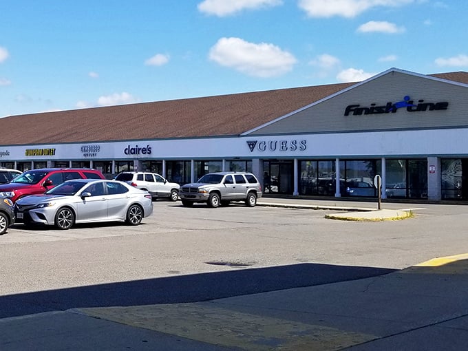Bench-sitters take a shopping break at Lighthouse Place, where Calvin Klein and other premium brands offer their wares at gentle prices.