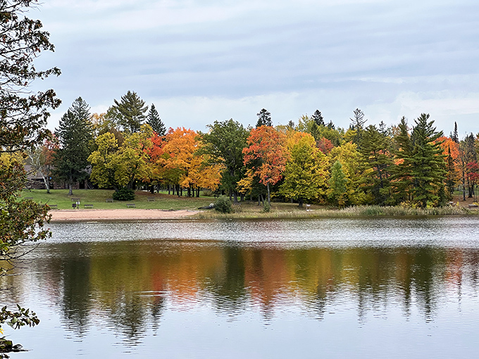 Fall's paintbrush transforms Pattison State Park into a kaleidoscope of colors reflected perfectly in its tranquil waters.
