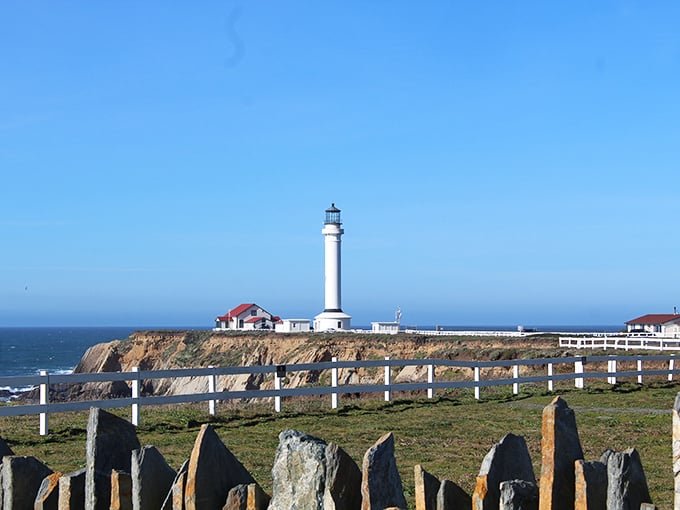 This towering sentinel watches over endless Pacific waters like a faithful guardian from maritime folklore.