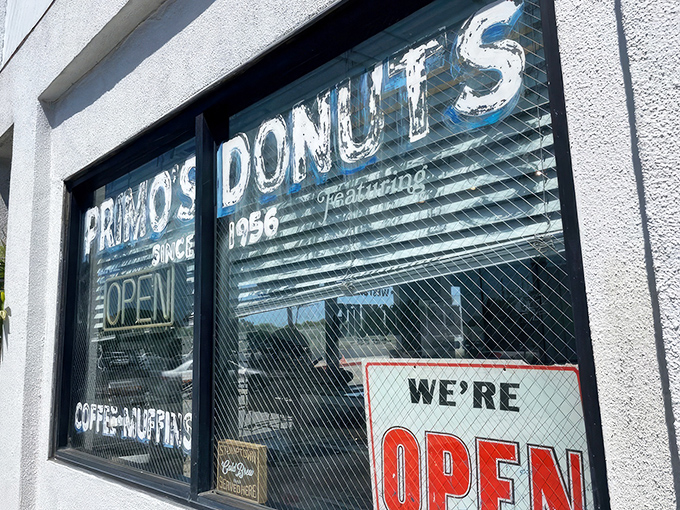 That "We're OPEN" sign at Primo's is the sweetest sight for donut lovers with morning cravings.