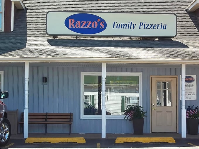 Blue doors, white trim, and a sangria patio sign – Razzo's looks like the summer home pizza built.