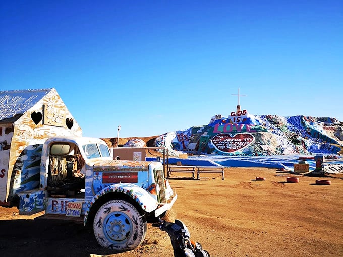 Painted trucks and rainbow hills create a mirage-like vision in the desert. Salvation Mountain is folk art on the grandest scale.