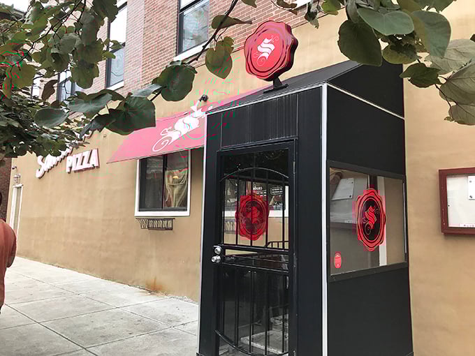 That distinctive red "S" logo beckons like a beacon for anyone seeking pizza that dares to be different.