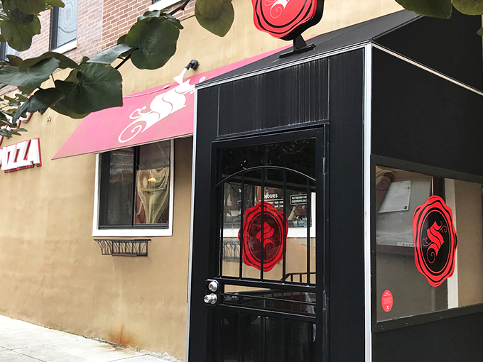 Santucci's Pizza: The black door with the red logo is like a portal to square pizza heaven. No ruby slippers required!