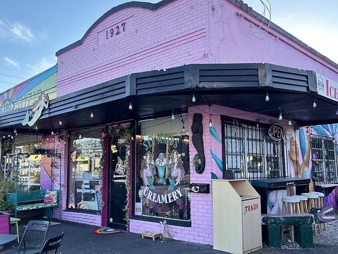 Twilight transforms this vintage mermaid haven into a glowing pink beacon for ice cream lovers seeking after-dinner magic.