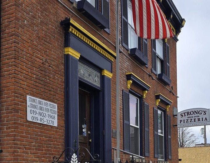 That classic brick fa&ccedil;ade isn't just for show&mdash;it houses pizza magic that would make any Italian nonna proud.