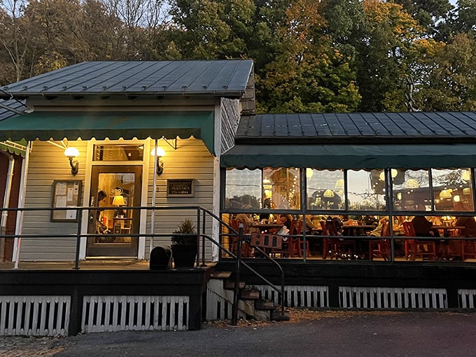 As evening falls, The Depot Grille glows with invitation. That screened porch practically whispers, "Your table is waiting."